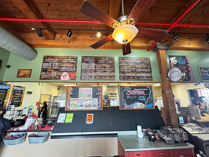 Menu boards presiding over the kitchen like delicious commandments written in chalk and smoke.