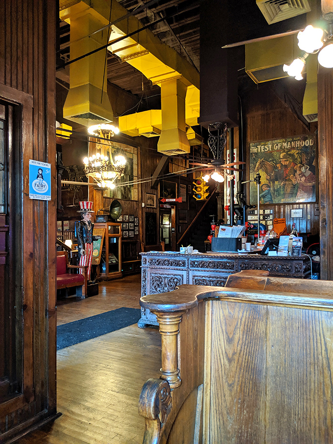 The host stand looks like it was borrowed from a Victorian mansion. That wooden craftsmanship isn't just furniture&mdash;it's a portal to a more elegant dining era.