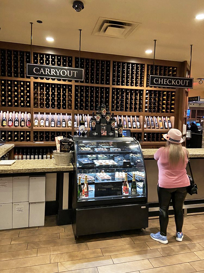 The retail area is like a library where all the books are delicious. Wine club members approach this counter with the excitement of kids at an ice cream shop.