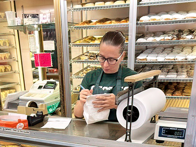 Behind the counter, the staff works with the precision of surgeons and the passion of artists creating edible masterpieces.