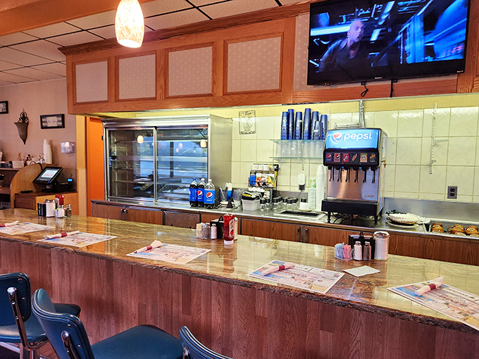 The counter—where solo diners find community, regulars claim their territory, and the coffee is always just a nod away from being refilled.