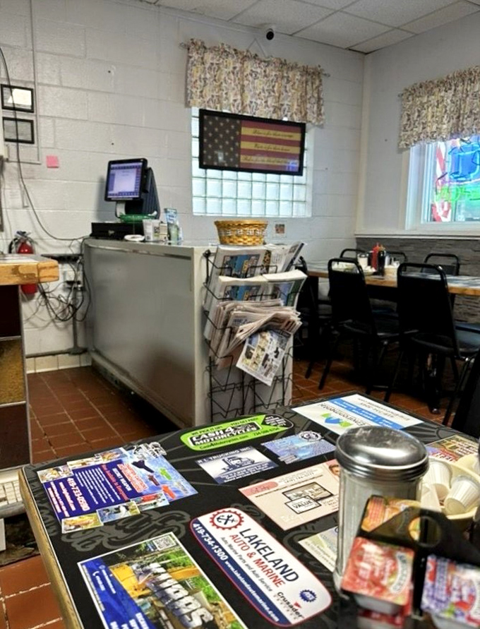 The counter where magic happens. Red squeeze bottles stand at attention while classic diner stools await the next hungry traveler.
