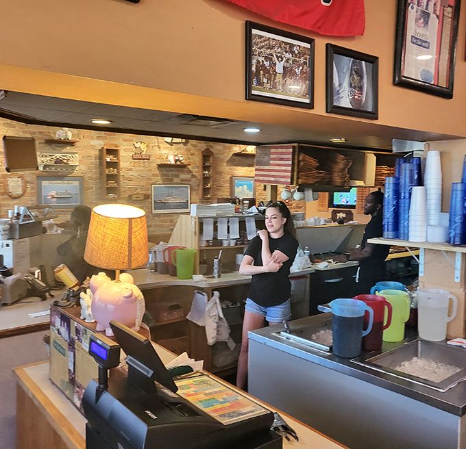 Behind the counter, pig figurines stand guard over BBQ treasures like tiny porcine sentinels of smoky goodness.