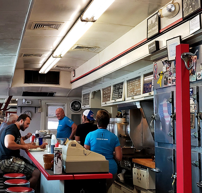 The counter seating offers front-row tickets to the short-order cooking show, where coffee flows as freely as the conversation.