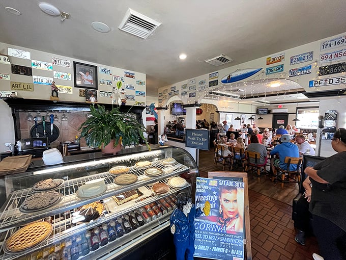 The dessert case – where pie dreams come true and diet plans go to die, all while license plates look on in silent, supportive judgment.