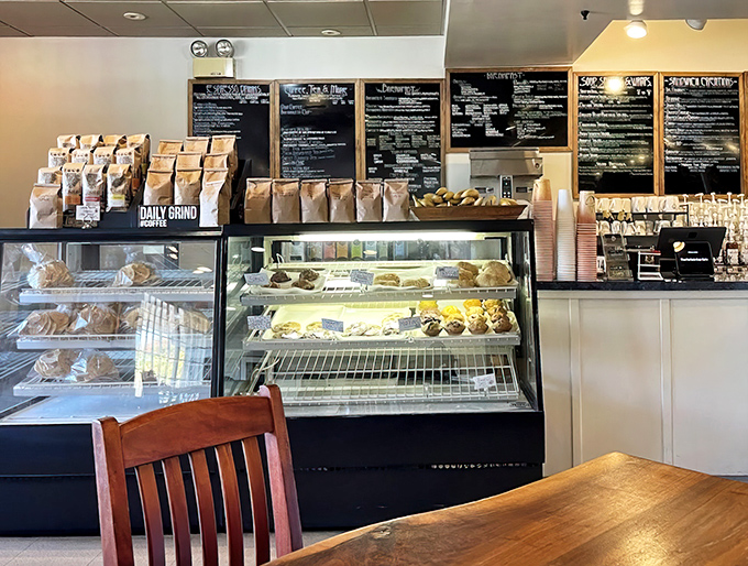 Fresh pastries tempt from behind glass while chalkboard menus promise coffee concoctions to suit every mood. Resistance is futile.