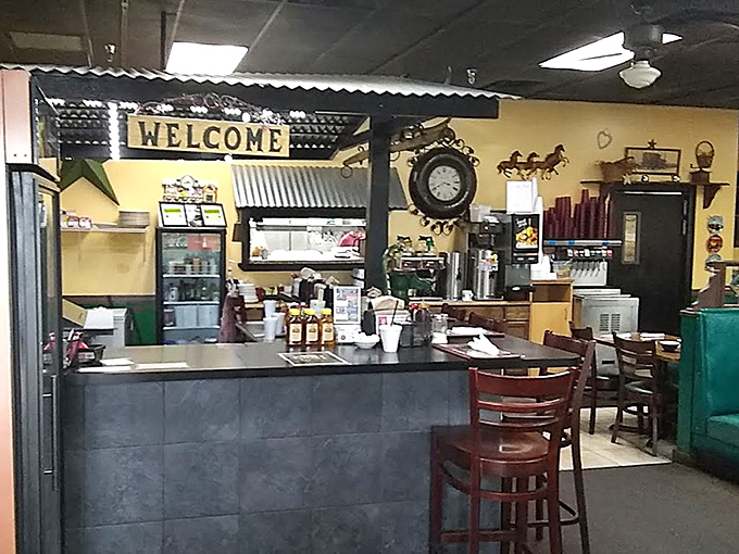The welcoming counter area where regulars perch, watching the breakfast ballet unfold in the kitchen beyond.