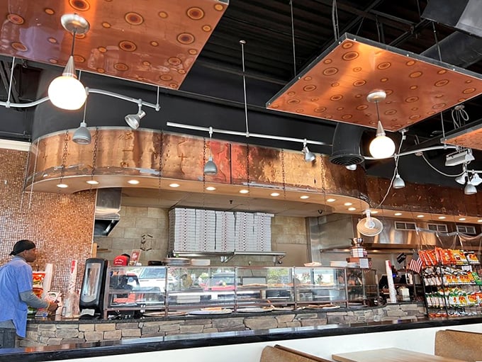 Where pizza dreams come true. The stone counter adds rustic charm to this temple of cheese and dough.