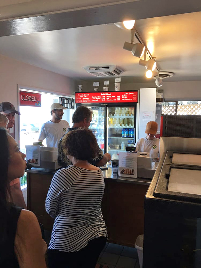 Where the magic begins: friendly staff efficiently taking orders while hungry patrons decide between countless oceanic delights.