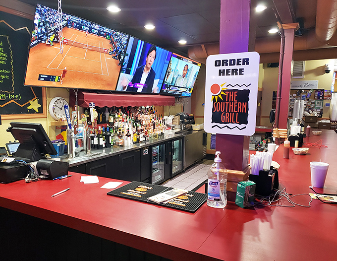 The bar area doubles as command central, where sports on TV and cold drinks create the perfect backdrop for sandwich appreciation.