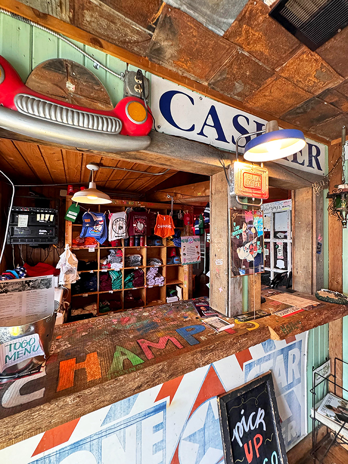 Rustic charm meets functional design at this counter. The weathered wood and vintage signs speak to Champy's authentic roadhouse roots.