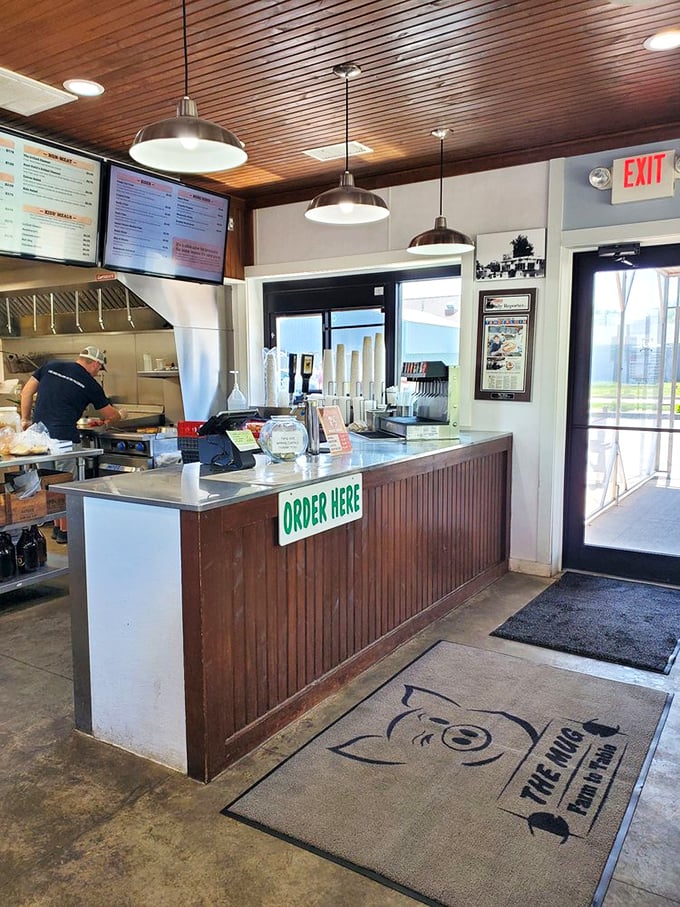 Behind the counter, where ordinary ingredients transform into extraordinary meals. That "ORDER HERE" sign might as well say "HAPPINESS STARTS HERE."