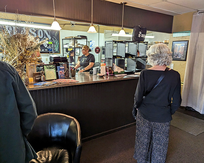 The host station serves as command central for this culinary operation. First impressions matter, and this one promises attention to detail throughout your visit.