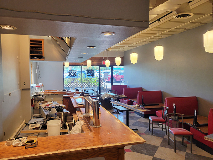 The bar area invites solo diners and couples alike to perch, sip, and watch the culinary magic unfold.