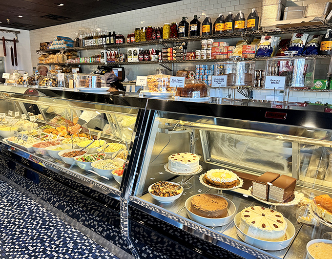 The deli counter showcases a tempting array of salads, sides, and cakes that make decision-making the hardest part of your visit.