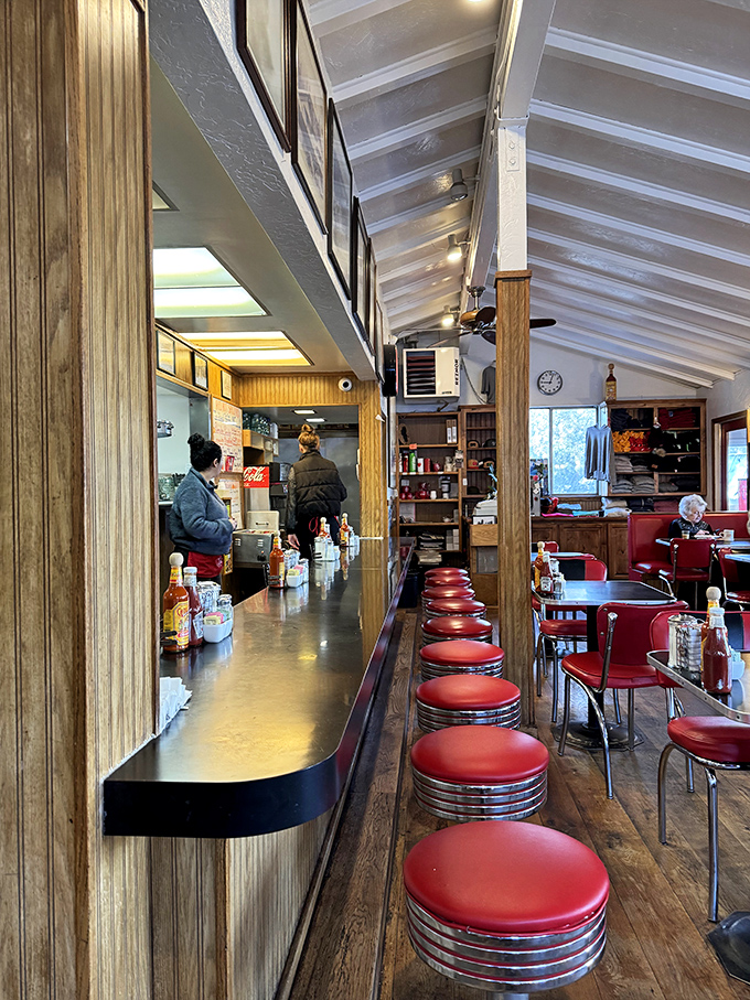 The counter view&mdash;where breakfast theater unfolds and regulars have claimed their spots through years of loyal patronage.
