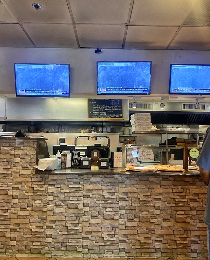 That stone counter with TVs overhead means you can catch the game while your brick oven pizza works its magic.