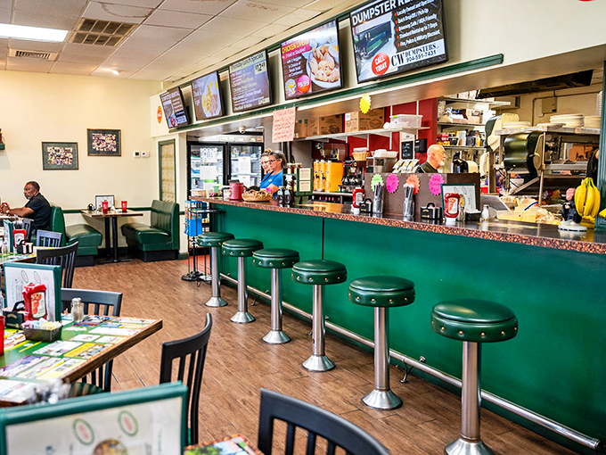 The counter where magic happens! Those green stools have witnessed more breakfast epiphanies than a self-help guru's weekend retreat.