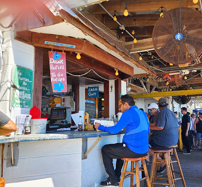 "Cash Only" signs and no-nonsense service. The counter where culinary dreams come true, one paper-wrapped sandwich at a time.