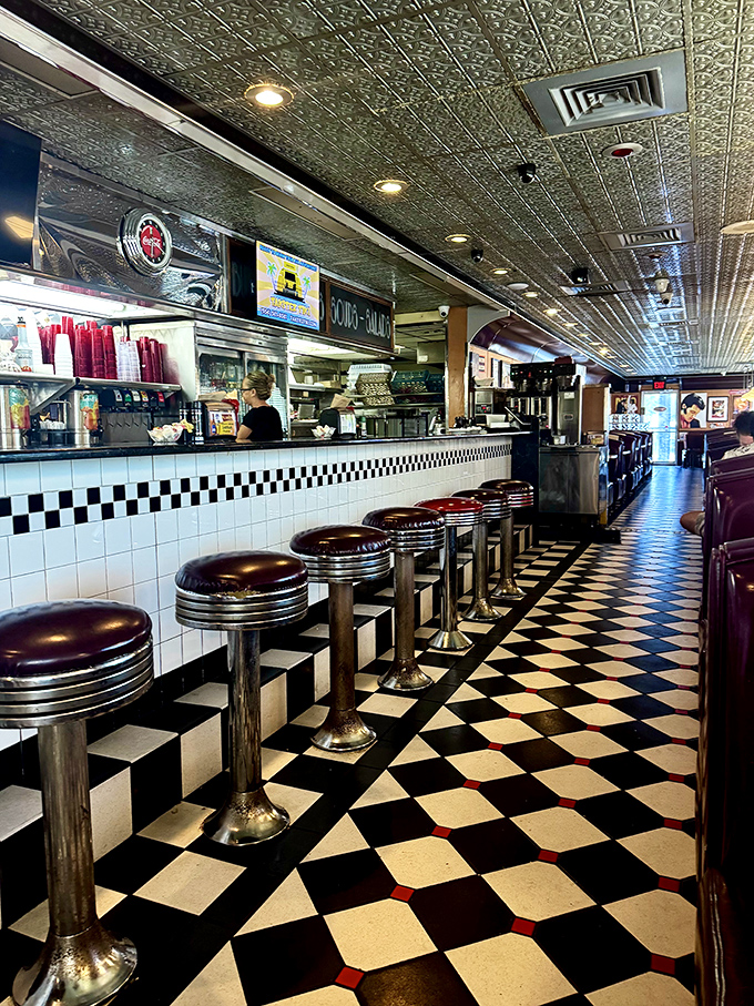 Counter seats lined up like front-row tickets to the greatest show on earth&mdash;breakfast theater with a side of people-watching.
