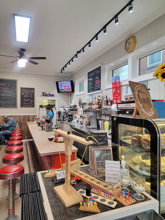 The counter and kitchen area buzz with activity, where breakfast magic happens in full view. No secrets here&mdash;just good, honest cooking.