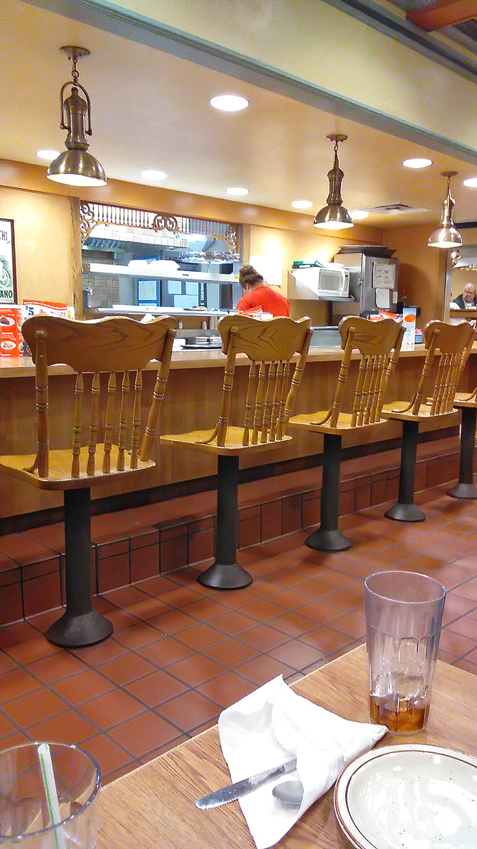 Counter seats: front-row tickets to the breakfast show. Where solo diners become temporary members of the morning crew.