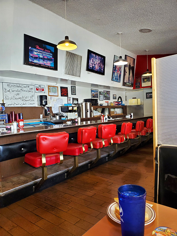 Those red counter seats have witnessed countless first dates, business deals, and regulars who've made this counter their second kitchen.