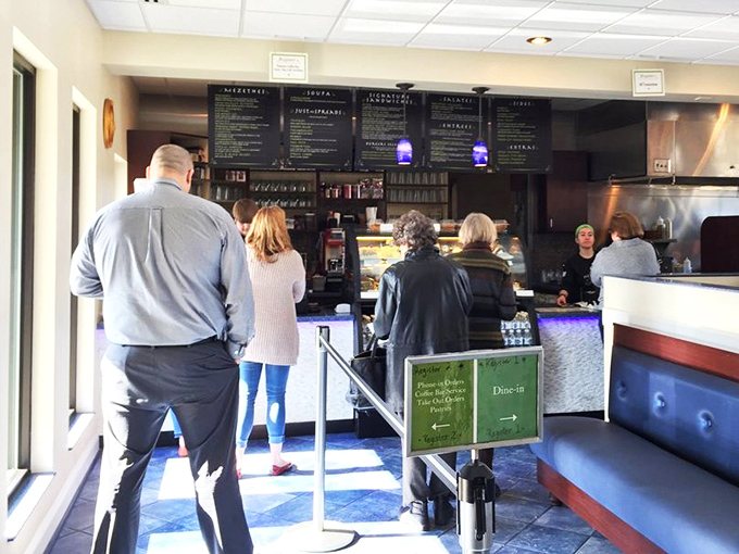 Where decisions get deliciously difficult. The menu board tempts with options while patrons contemplate which Greek delight to try first.