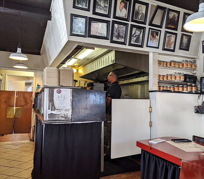 Behind the counter is where the magic happens – no fancy kitchen stadium, just dedicated folks who understand the science of smoke.