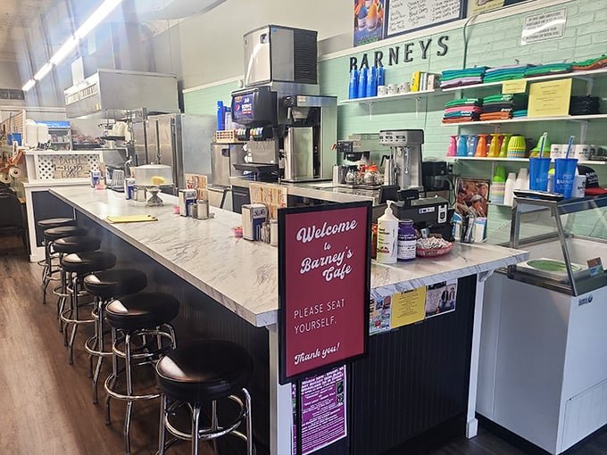 The counter where magic happens &ndash; stools awaiting your arrival and a "seat yourself" sign that feels like a warm handshake.