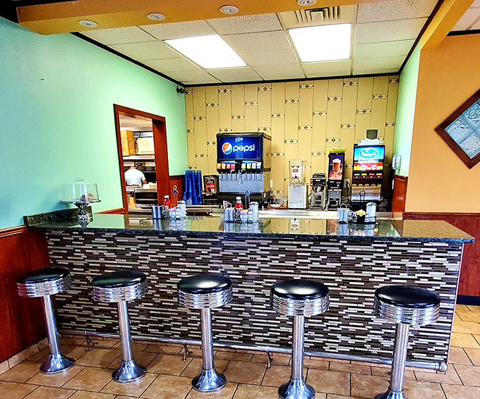 Classic counter seating where solo diners become regulars and servers remember your order before you sit down. The beating heart of any great diner.