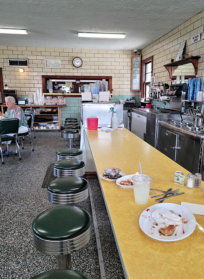 Where ice cream alchemists work their magic. Those green stools have supported generations of happy customers awaiting their frozen treasures.