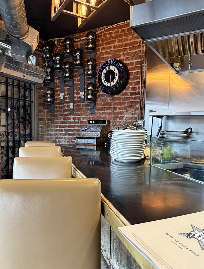 Counter seating where solo diners become philosophers and coffee cups never run empty&mdash;the diner social contract.