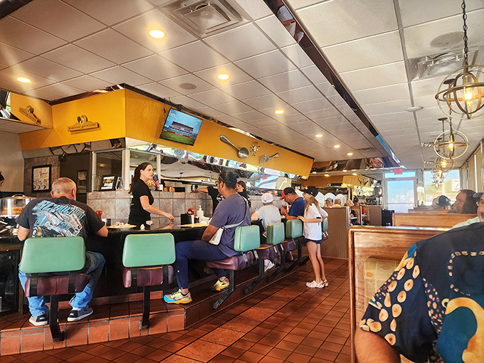 Counter seating: where solo diners become part of the restaurant family and get a front-row view to the breakfast ballet.