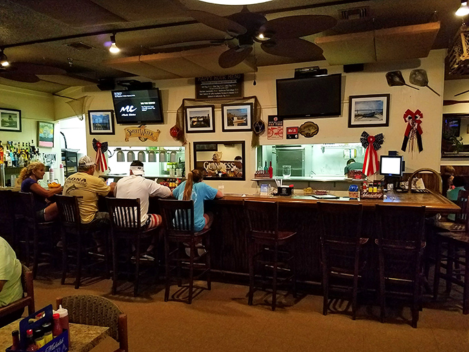 The bar area—where strangers become friends over stories of "the one that got away" and cocktails that didn't.