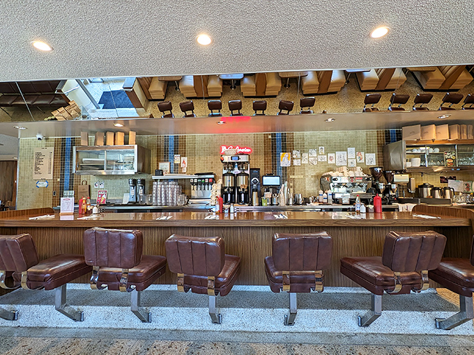 Counter seats: front-row tickets to the breakfast theater, where coffee mugs are always full and the griddle sizzles with possibility.