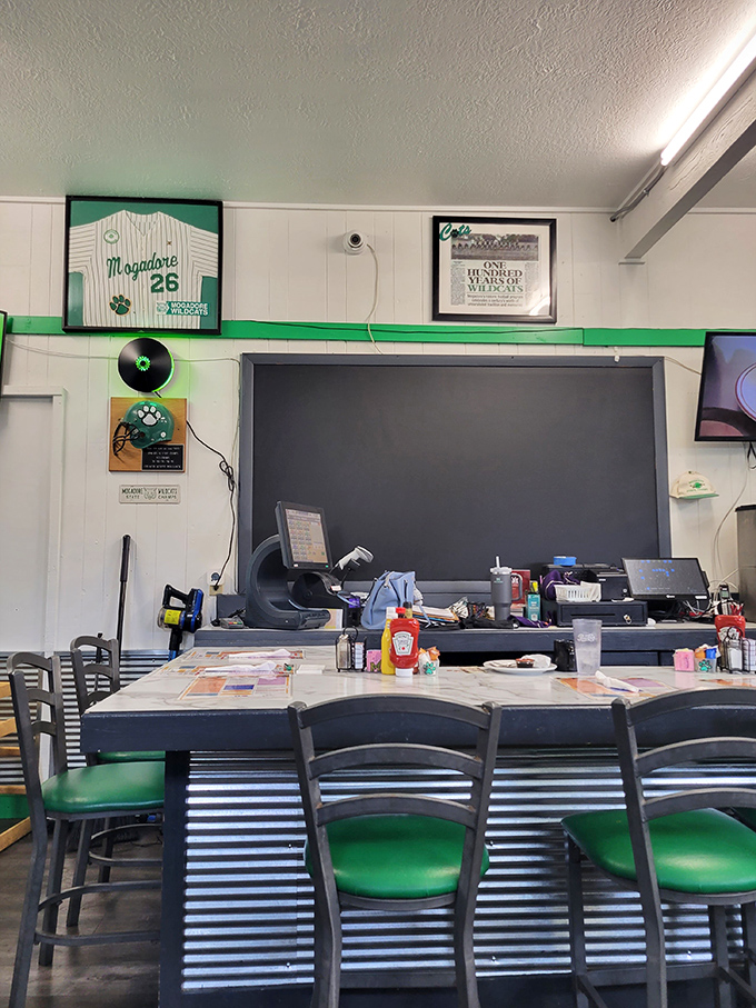 The counter seating offers front-row tickets to the kitchen action, complete with Mogadore sports memorabilia setting the hometown scene.