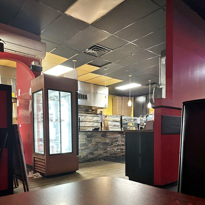 A glimpse into the heart of operations&mdash;where pizza dreams come to life amid the warm glow of pendant lights.