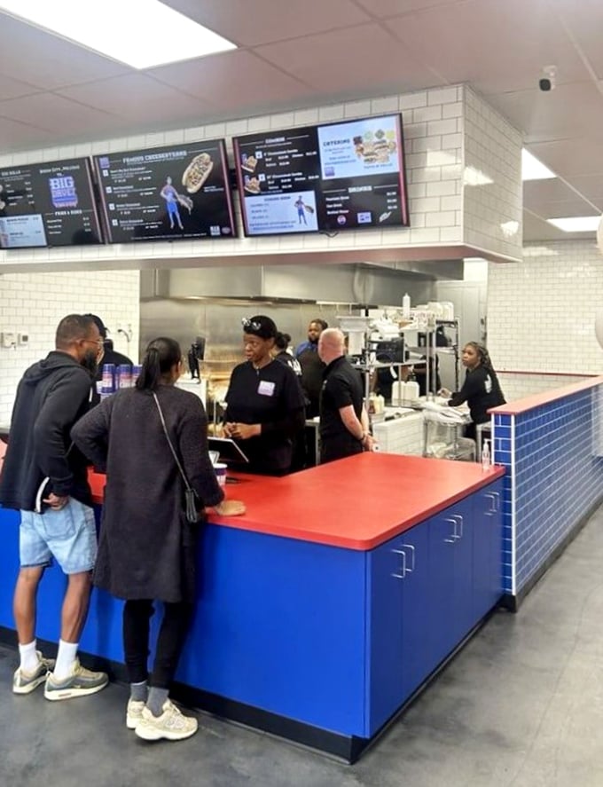 The counter where dreams come true. Customers wait with the patience of pilgrims, knowing transcendent sandwich experiences are worth every minute.