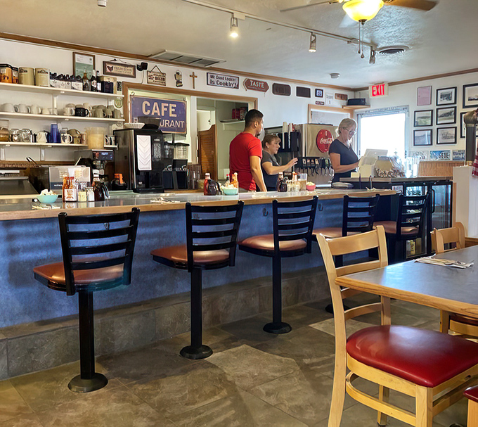Counter seating: where solo diners become part of the Izzy's family and servers perform their coffee-pouring ballet with practiced precision.