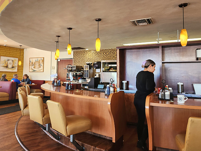 Counter culture at its finest. The curved counter offers front-row seats to the breakfast show, where coffee flows freely and regulars exchange morning pleasantries. 