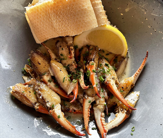 Crab claws so fresh they might just pinch you back. Bathed in herb butter and begging to be dunked in that crusty bread.