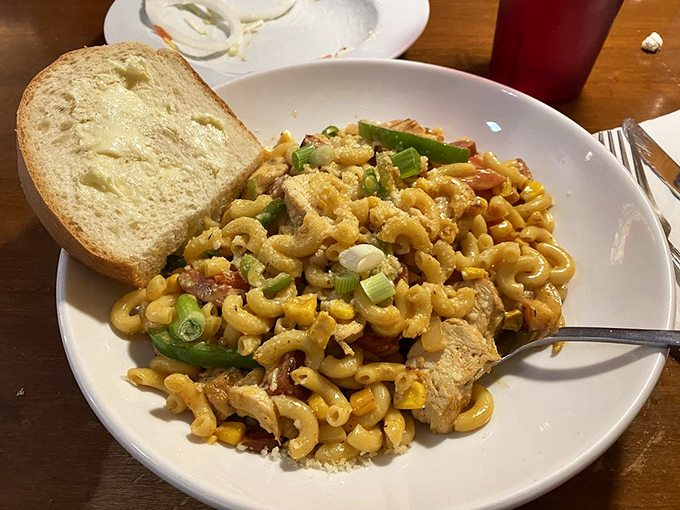 Mac and cheese that's had an exciting life makeover. Vibrant with green onions and protein, it's comfort food that's been to finishing school.