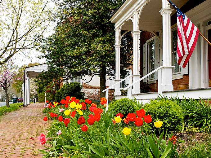 The Crouch House's white porch and American flag offer a quintessential slice of small-town America. Norman Rockwell couldn't have painted a more perfect scene if he tried.