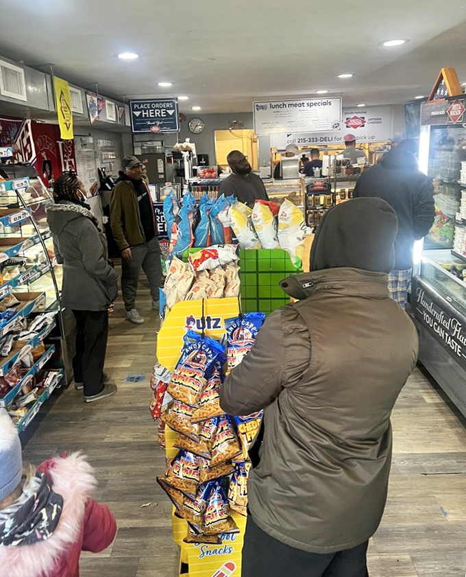 The lunch rush at Marinucci's isn't just customers waiting—it's a congregation of hoagie disciples making their daily pilgrimage to sandwich heaven.