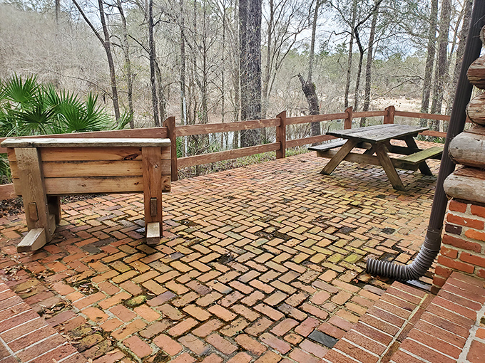This brick patio offers front-row seats to nature's greatest show. The herringbone pattern adds a touch of unexpected elegance to wilderness dining.