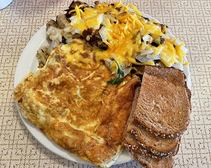 A proper diner omelet doesn't hide behind fancy ingredients&mdash;it proudly displays its golden exterior and generous fillings like medals of honor.