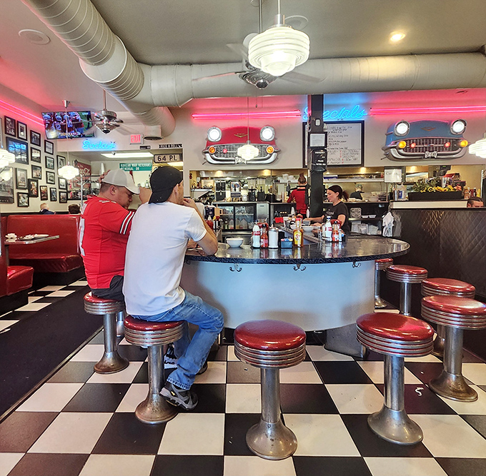 The circular counter isn't just functional&mdash;it's social architecture, turning strangers into neighbors over coffee refills and shared condiments.