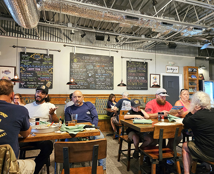 The dining room hums with the satisfied murmurs of people making food memories. Those chalkboard specials in the background are basically seafood lottery tickets.