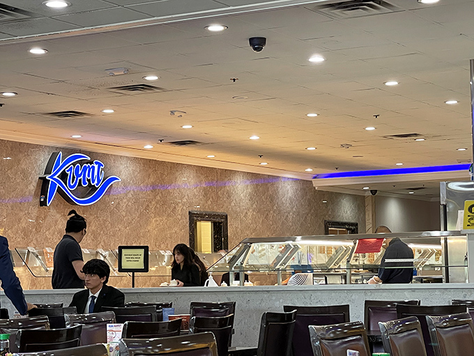 The buffet's inner sanctum, where diners plot their strategic approaches. Note the focused expressions of culinary determination.